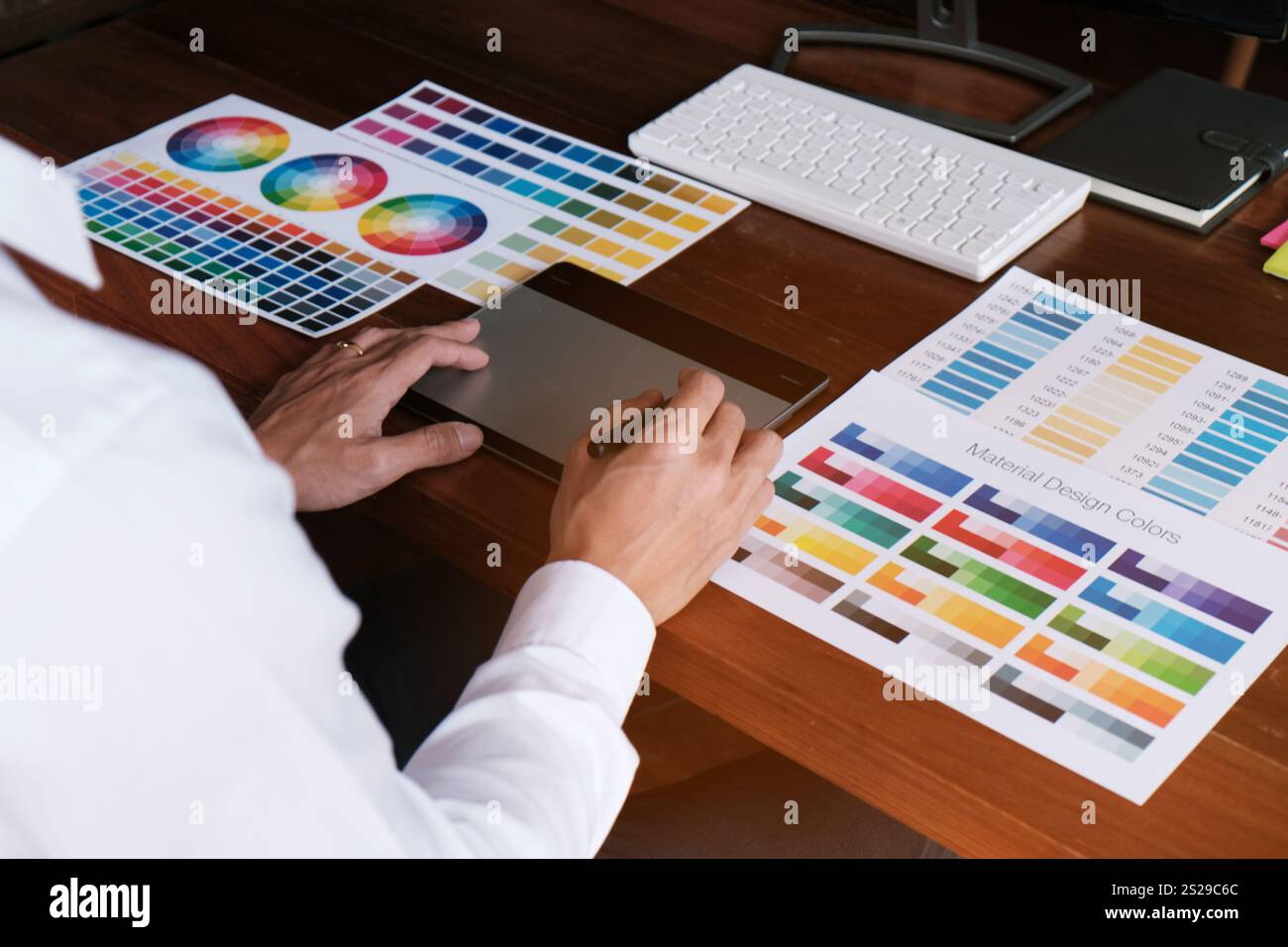 Graphic designer working on digital tablet. artist drawing on graphic ...