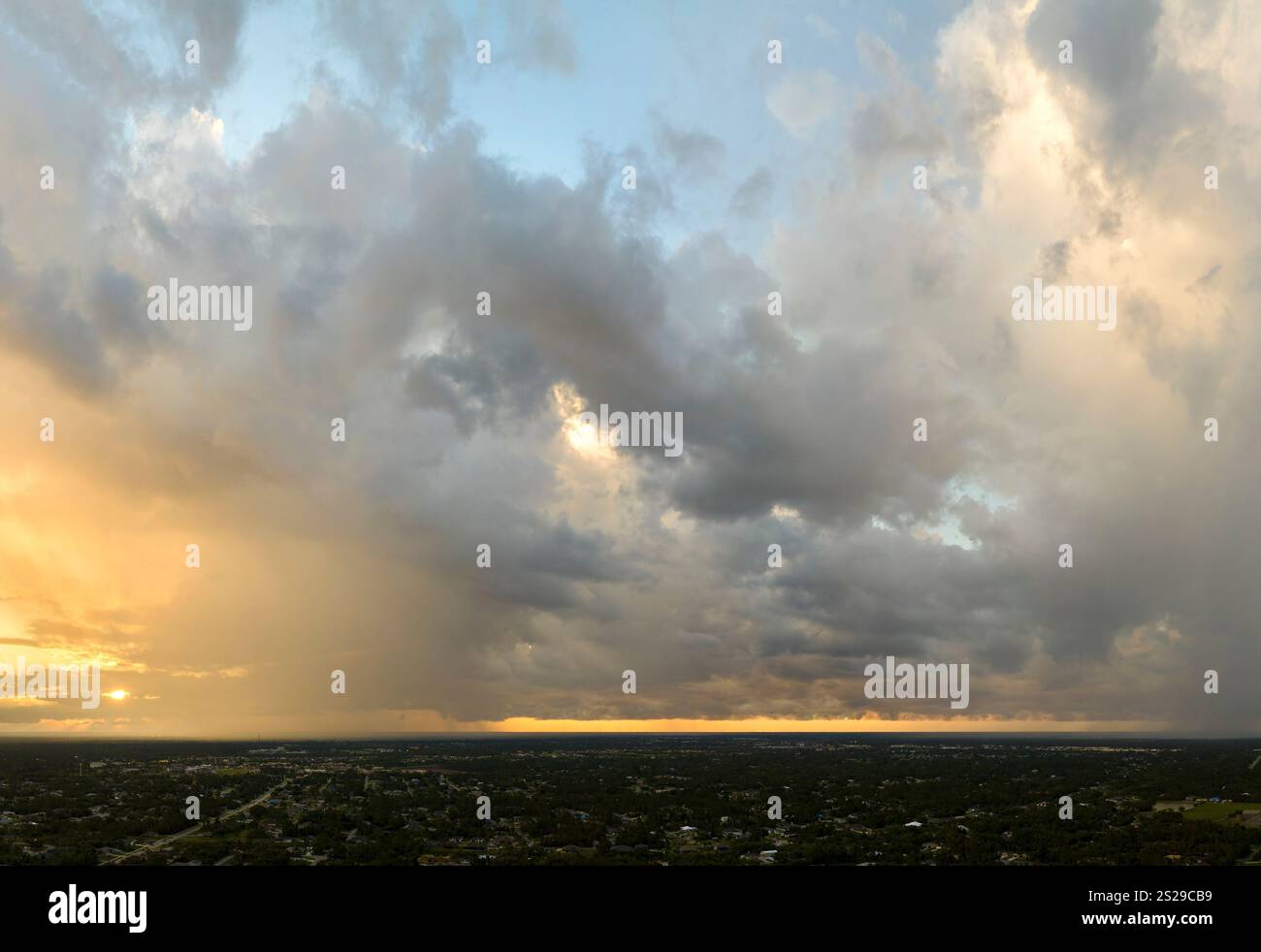 Tropical thunderstorm precipitation falling down on Florida town. Rain ...