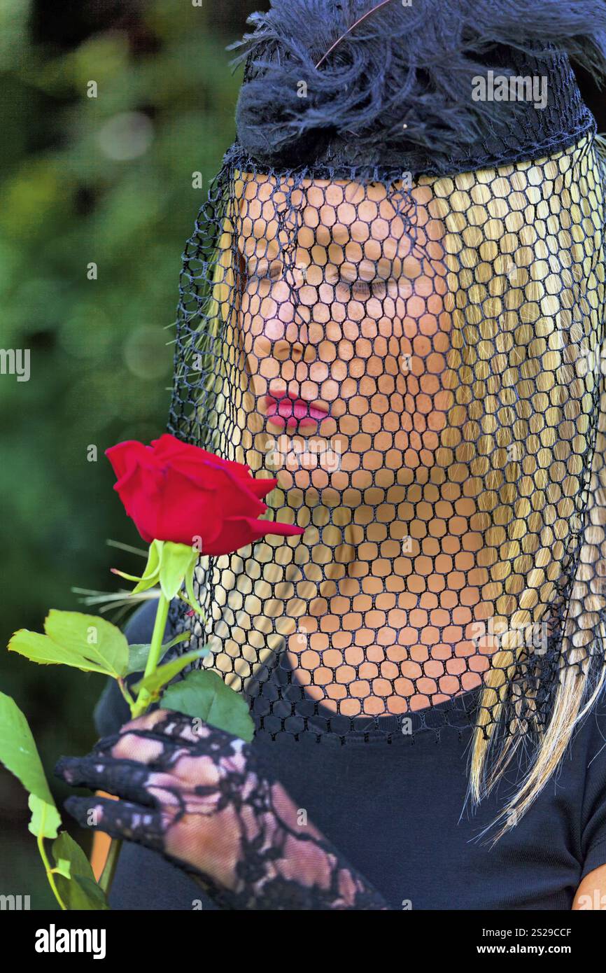 A young, grieving widow with a veil and rose. Death and inheritance ...