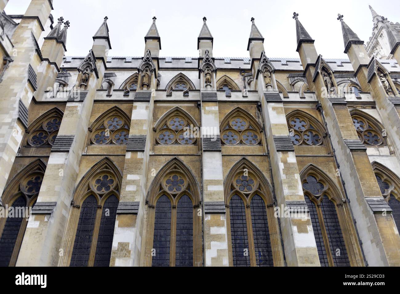 Side facade of Westminster Abbey with Gothic windows and details ...
