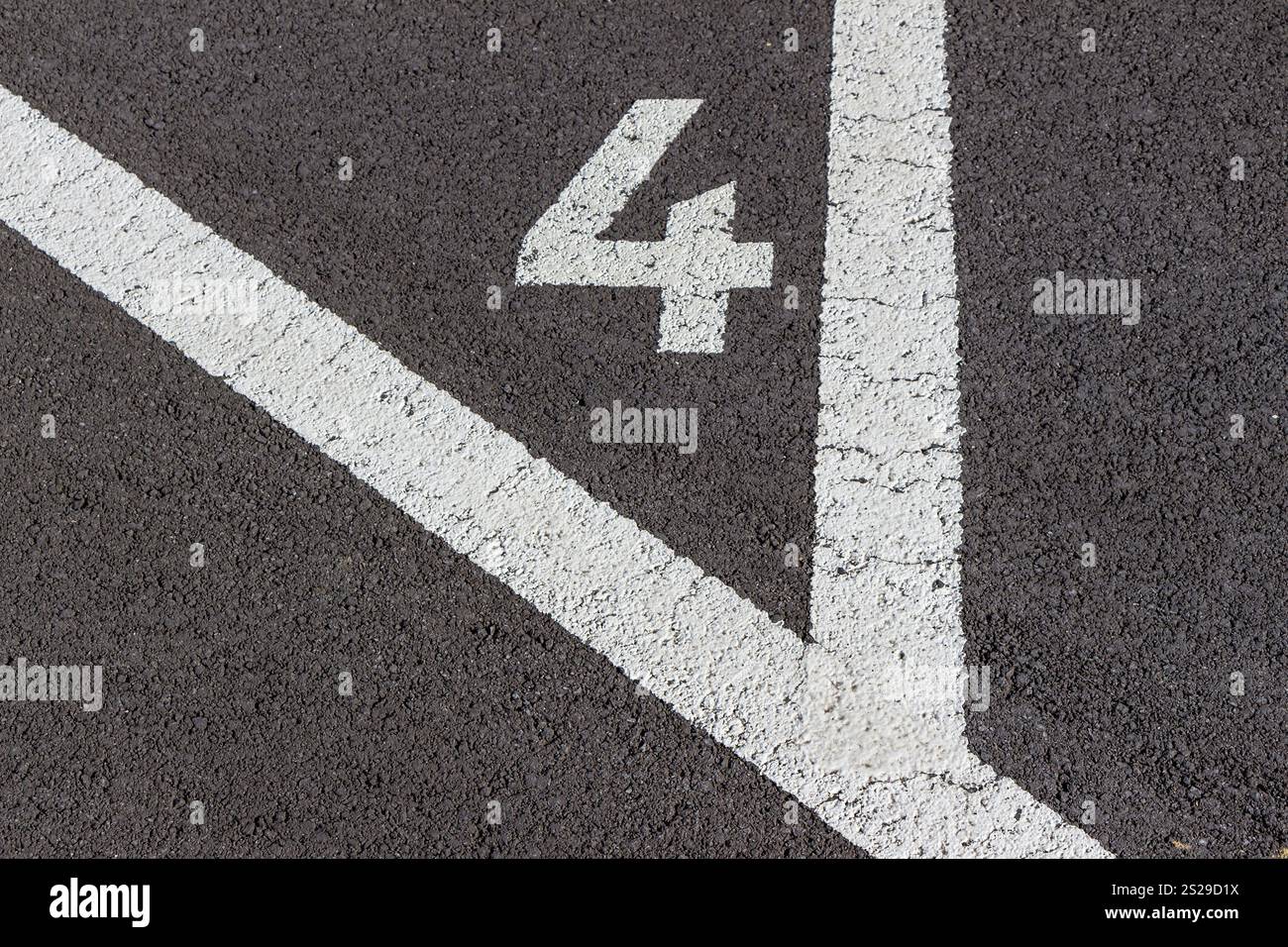 In one car park, the individual parking spaces are labelled with ...