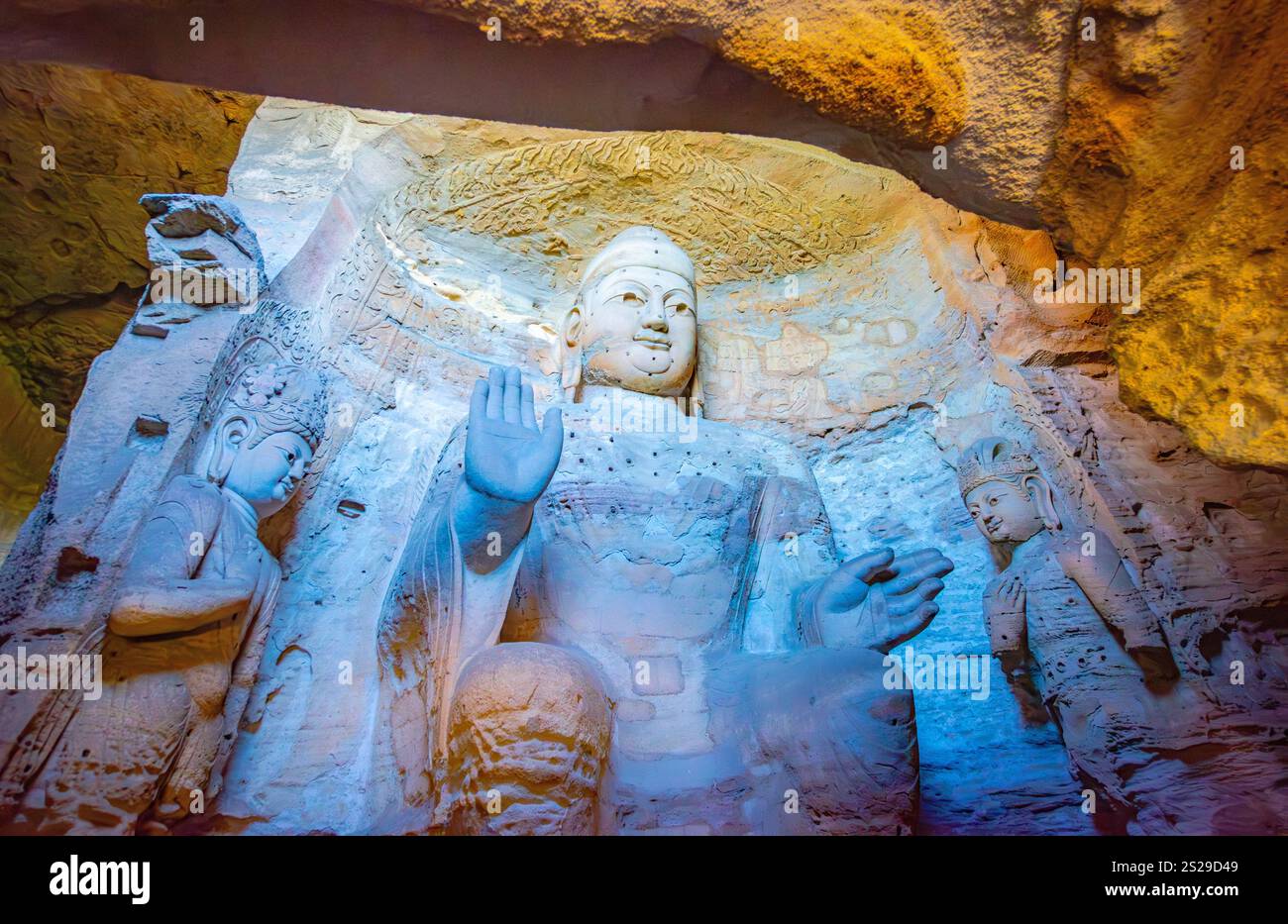 Giant Buddha statue at Yungang Grottoes in Datong, Shanxi Stock Photo ...