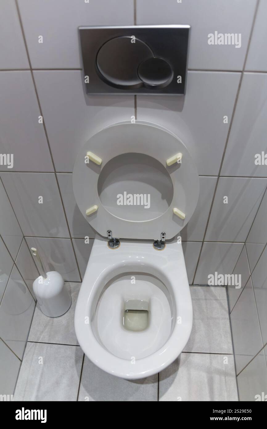 A toilet in a flat. With open toilet seat Stock Photo - Alamy