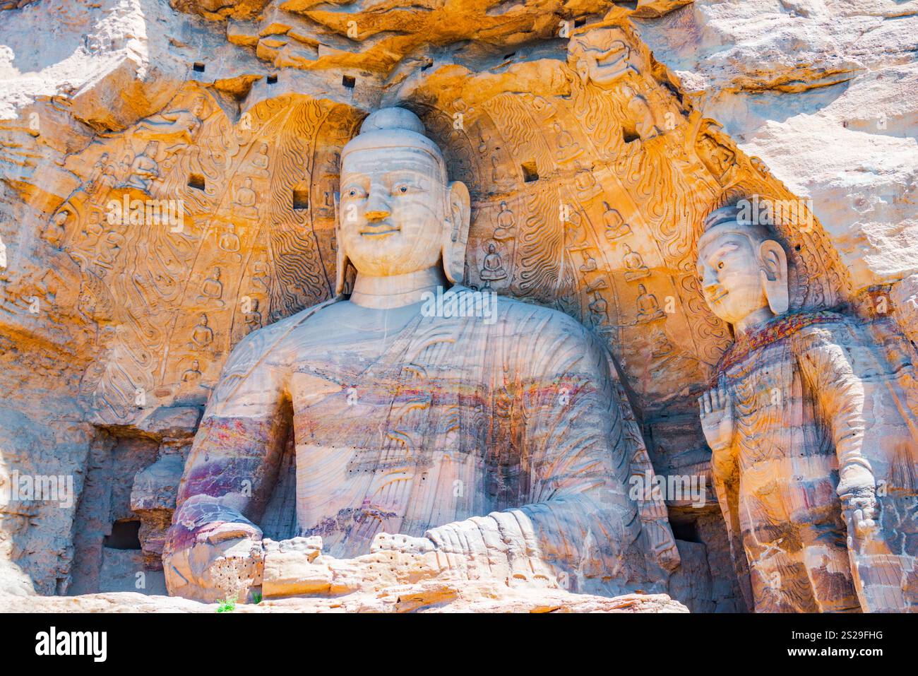 Giant Buddha statue at Yungang Grottoes in Datong, Shanxi Stock Photo ...