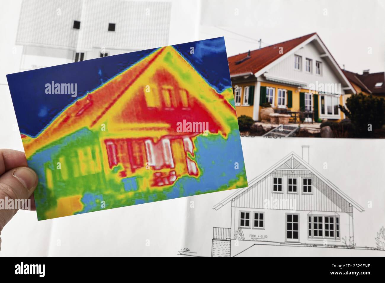 Saving energy through thermal insulation. House photographed with ...