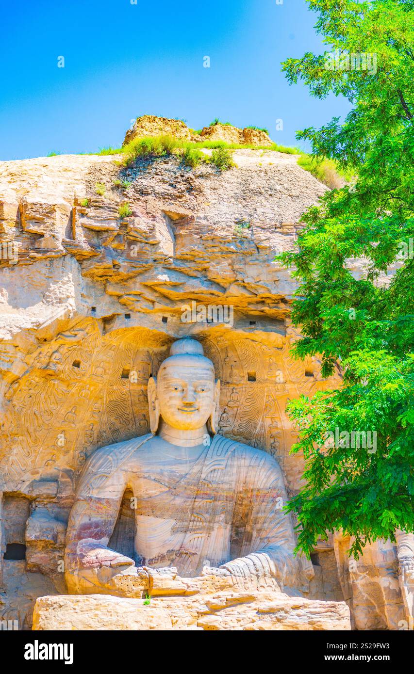 Giant Buddha statue at Yungang Grottoes in Datong, Shanxi Stock Photo ...