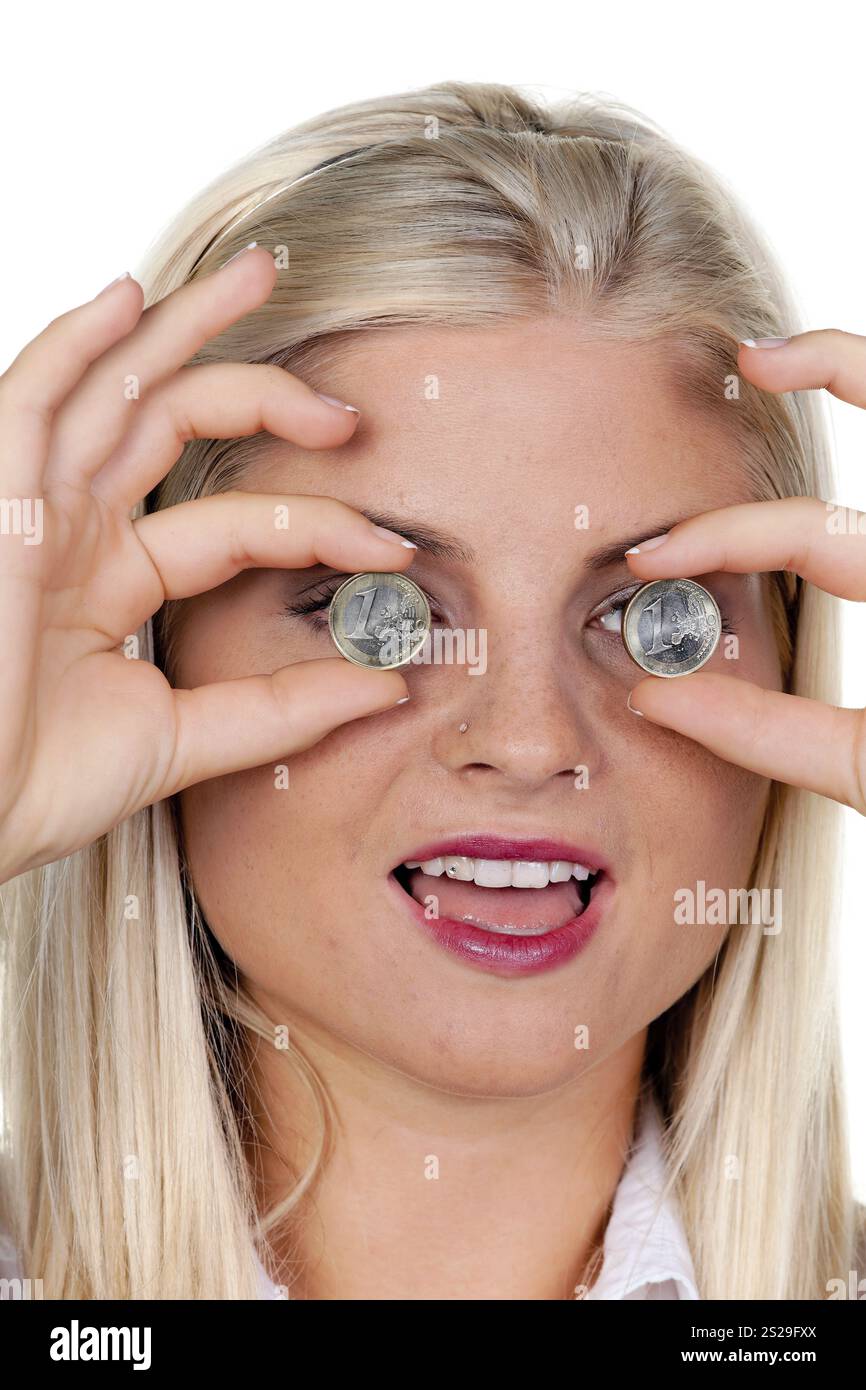 Young woman with euro money coins in front of her eyes Stock Photo - Alamy