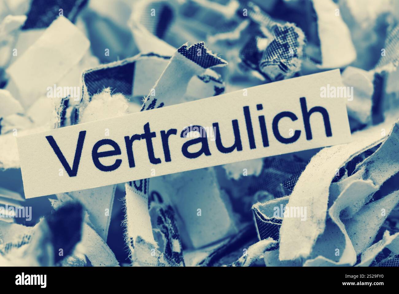 Paper shreds with the keyword Confidential, symbolic photo for data ...