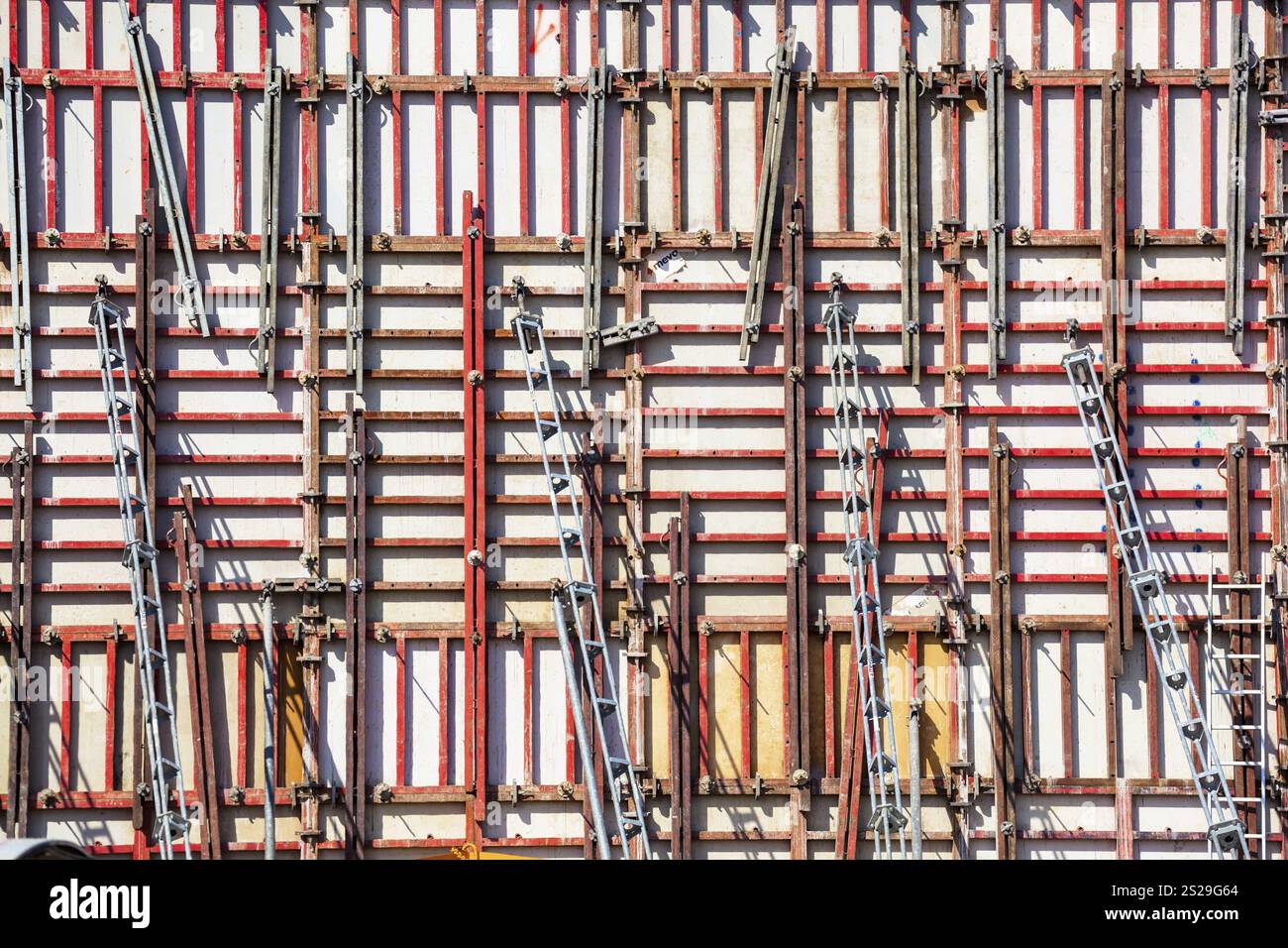 Formwork and struts during the construction of a new concrete wall on a ...