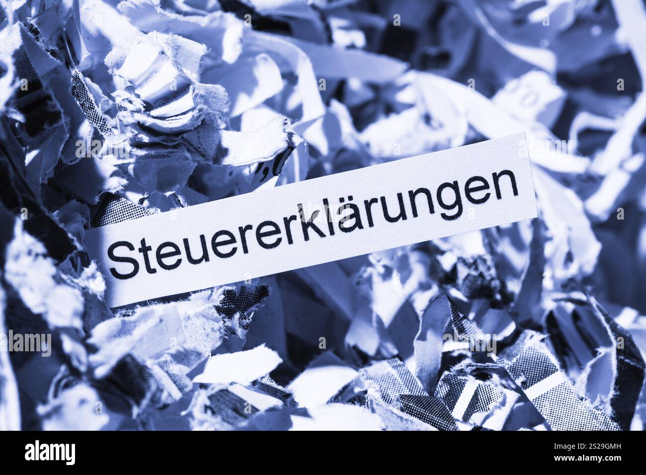 Paper shreds with the keyword tax returns, symbolic photo for tax ...