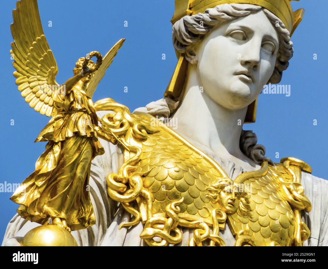 The parliament in Vienna, Austria. With the statue of Pallas Athena, the Greek goddess of wisdom ...