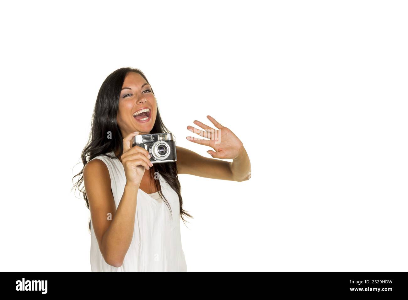 A young woman takes photos with a retro camera Austria Stock Photo - Alamy