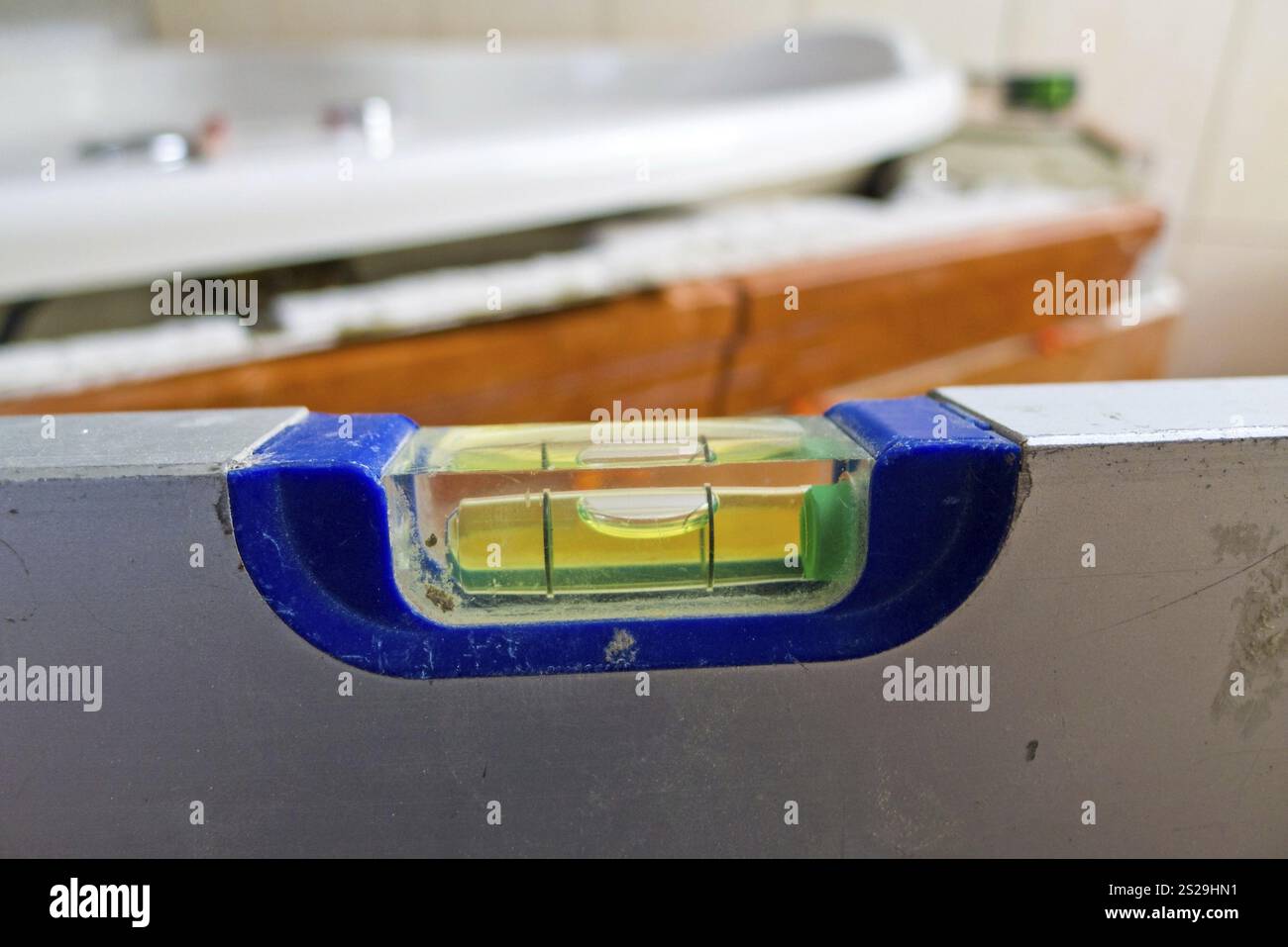 A spirit level on a building site. Symbolic image for botched ...