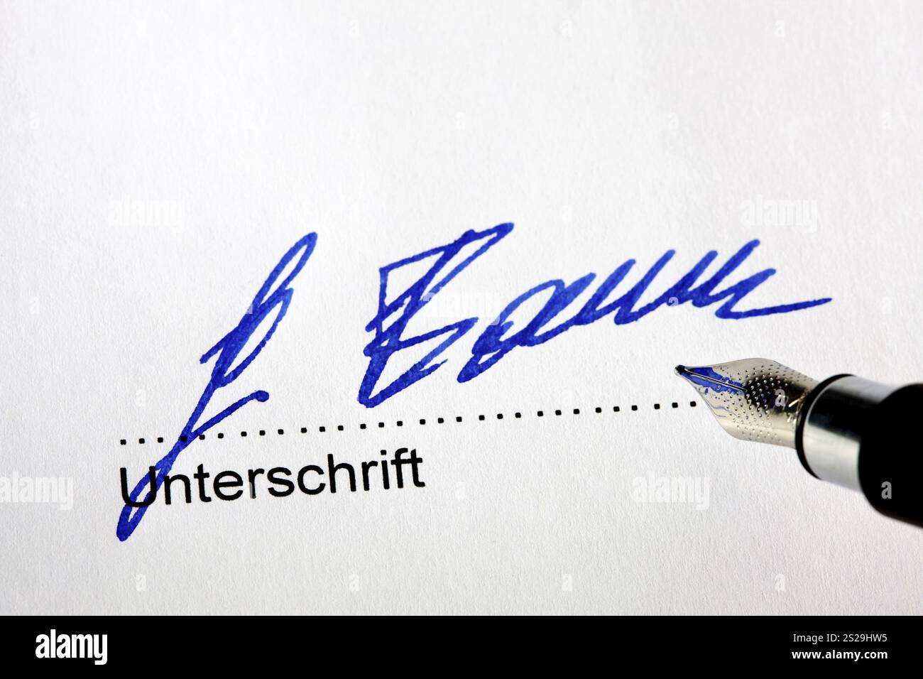 Handwritten signature with fountain pen under a letter Stock Photo - Alamy