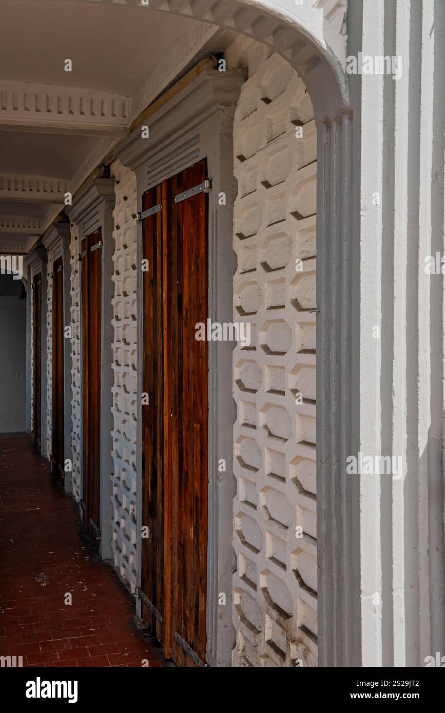 A striking blend of geometric patterns and rustic wooden shutters adorn ...