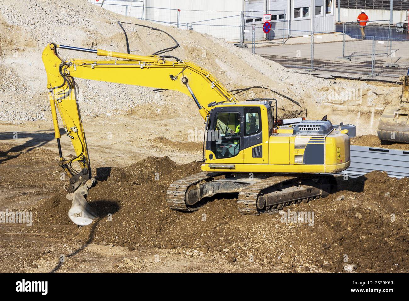 Excavator on a building site. Excavator shovel with earth, earthworks ...