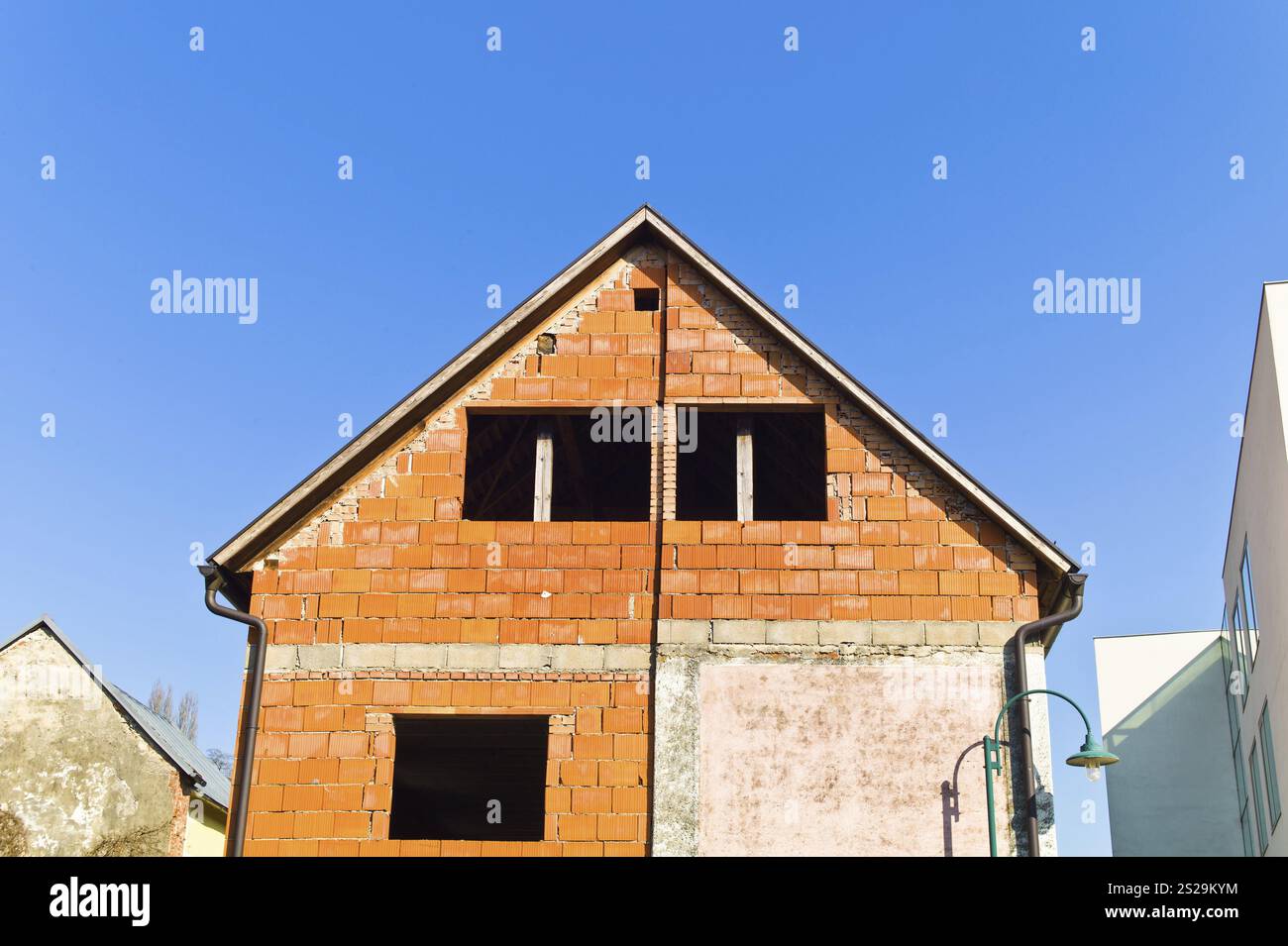 The remodelling and extension of a residential building. In front of a ...