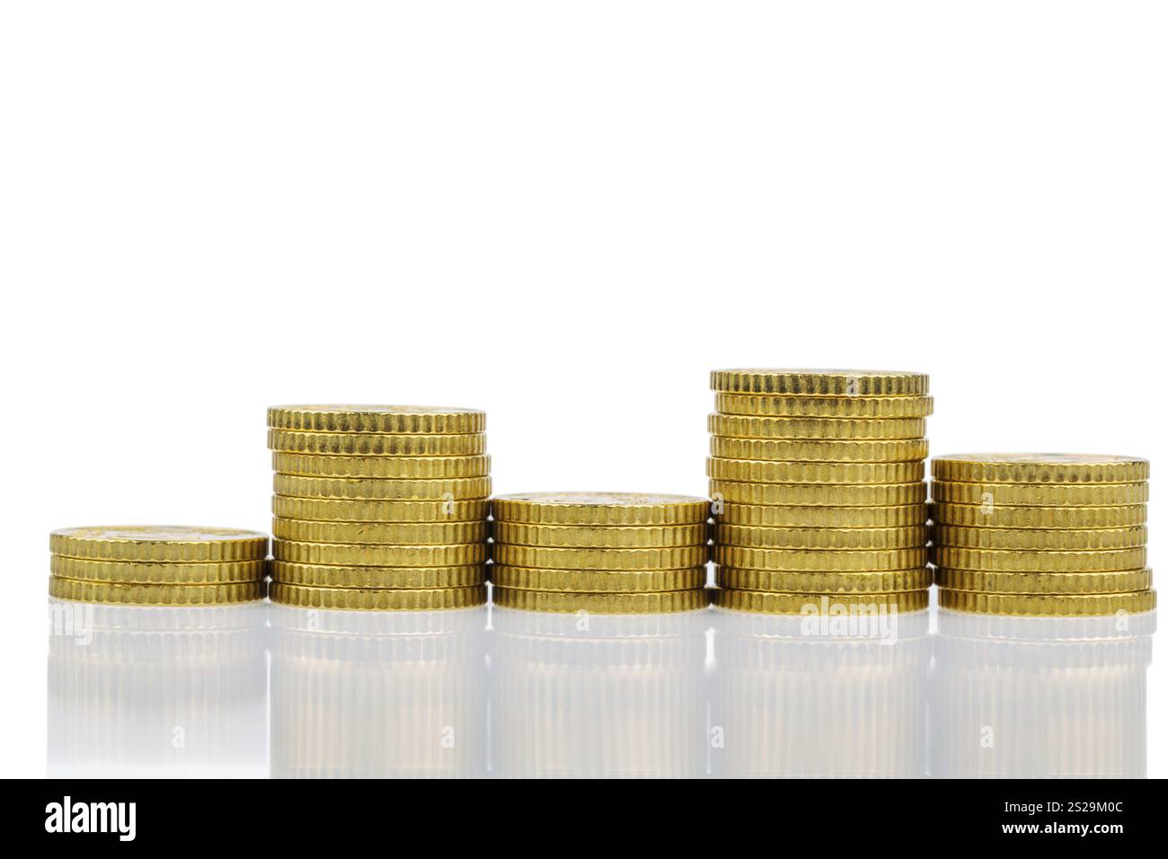 Stacked coins, alternating high and low stacks, symbolic photo for ...