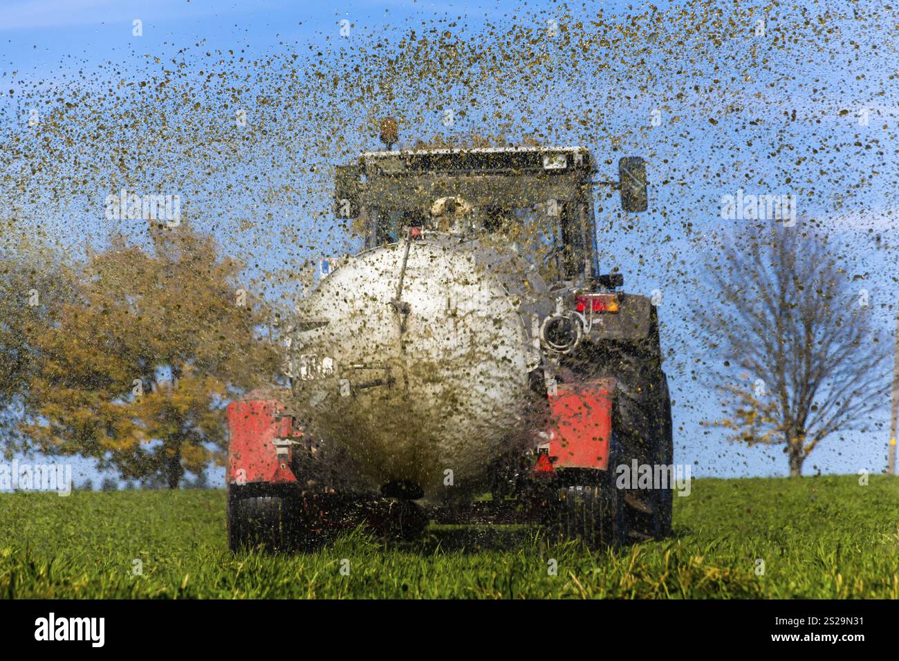 Tractors autumn fertilize fields hi-res stock photography and images ...