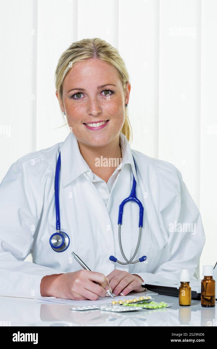Doctor prescribes medication young hi-res stock photography and images ...