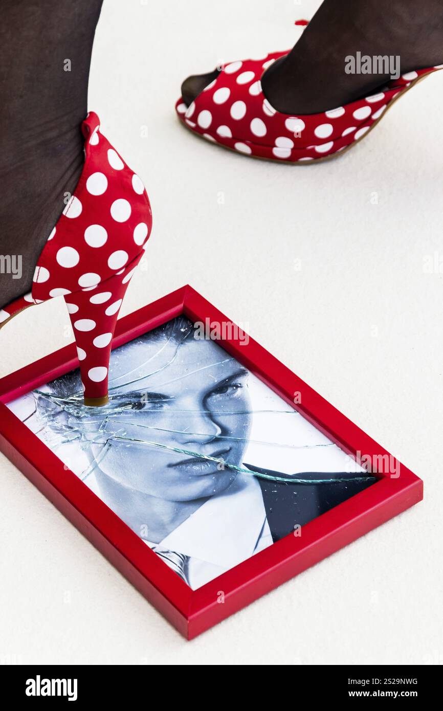 Broken picture frame and high heels. Symbolic photo for divorce ...