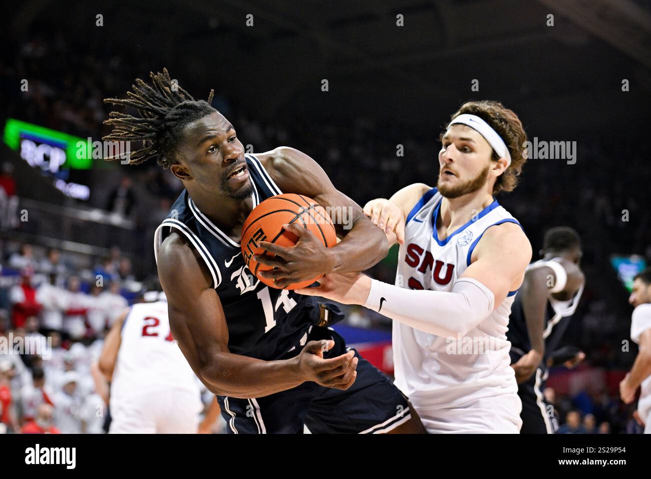 Duke guard Sion James (14) and SMU forward Matt Cross (33) battle for ...