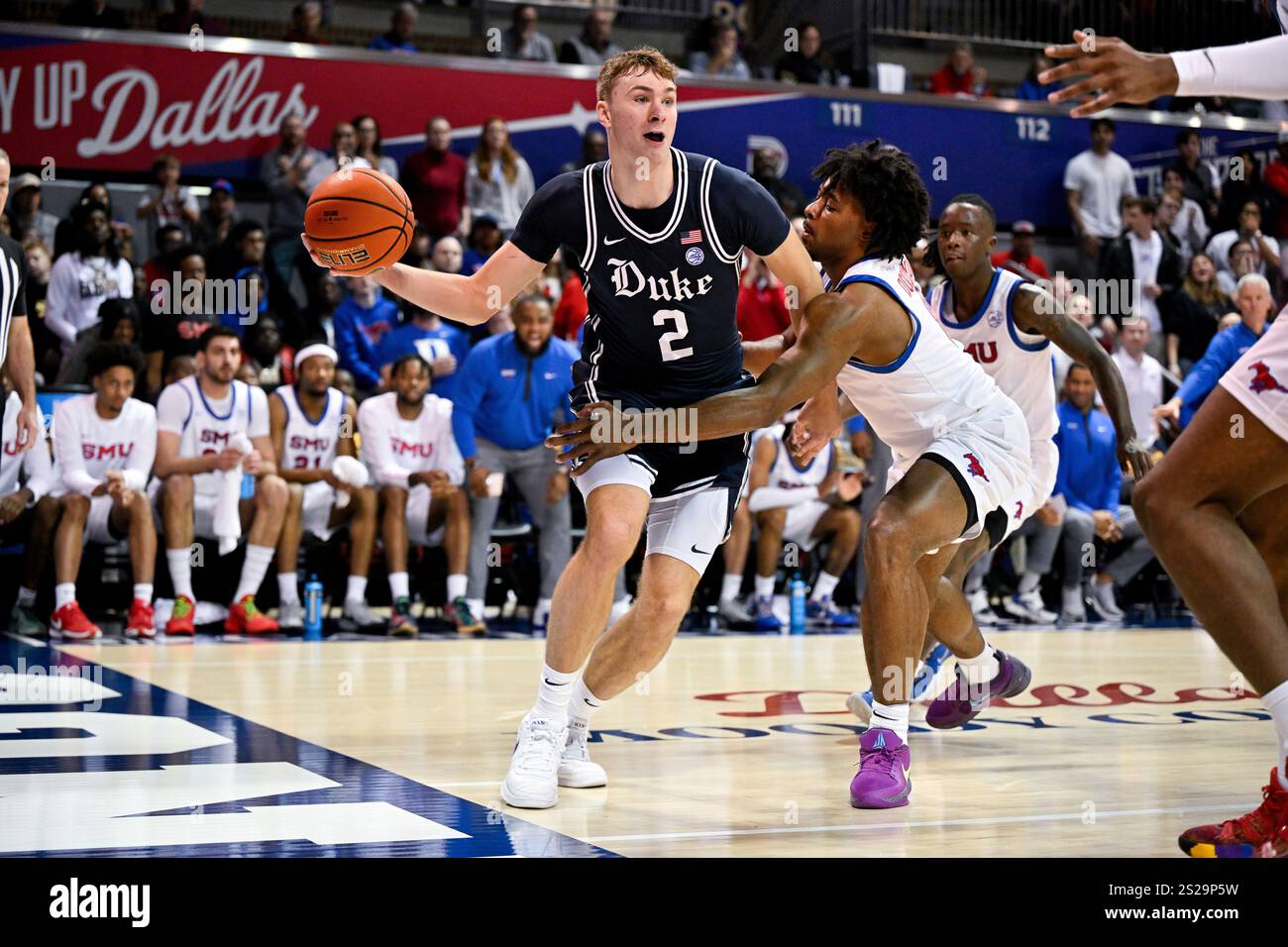 Duke guard Cooper Flagg (2) drives to the basket past SMU forward Yohan Traore (21) during an ...