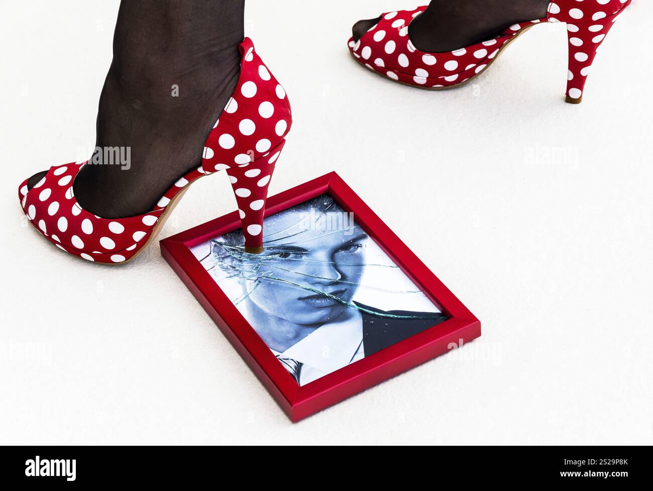 Broken picture frame and high heels. Symbolic photo for divorce ...