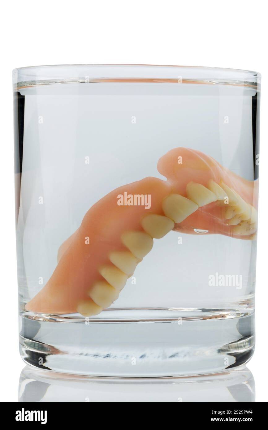 Denture with water glass, symbolic photo for dentures and care Austria ...