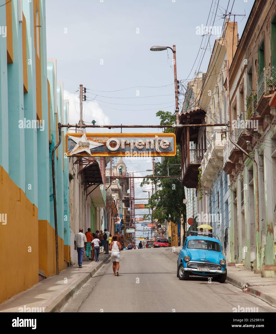 A Blue vintage chevrolet car and the Typical tradiional colonial houses ...