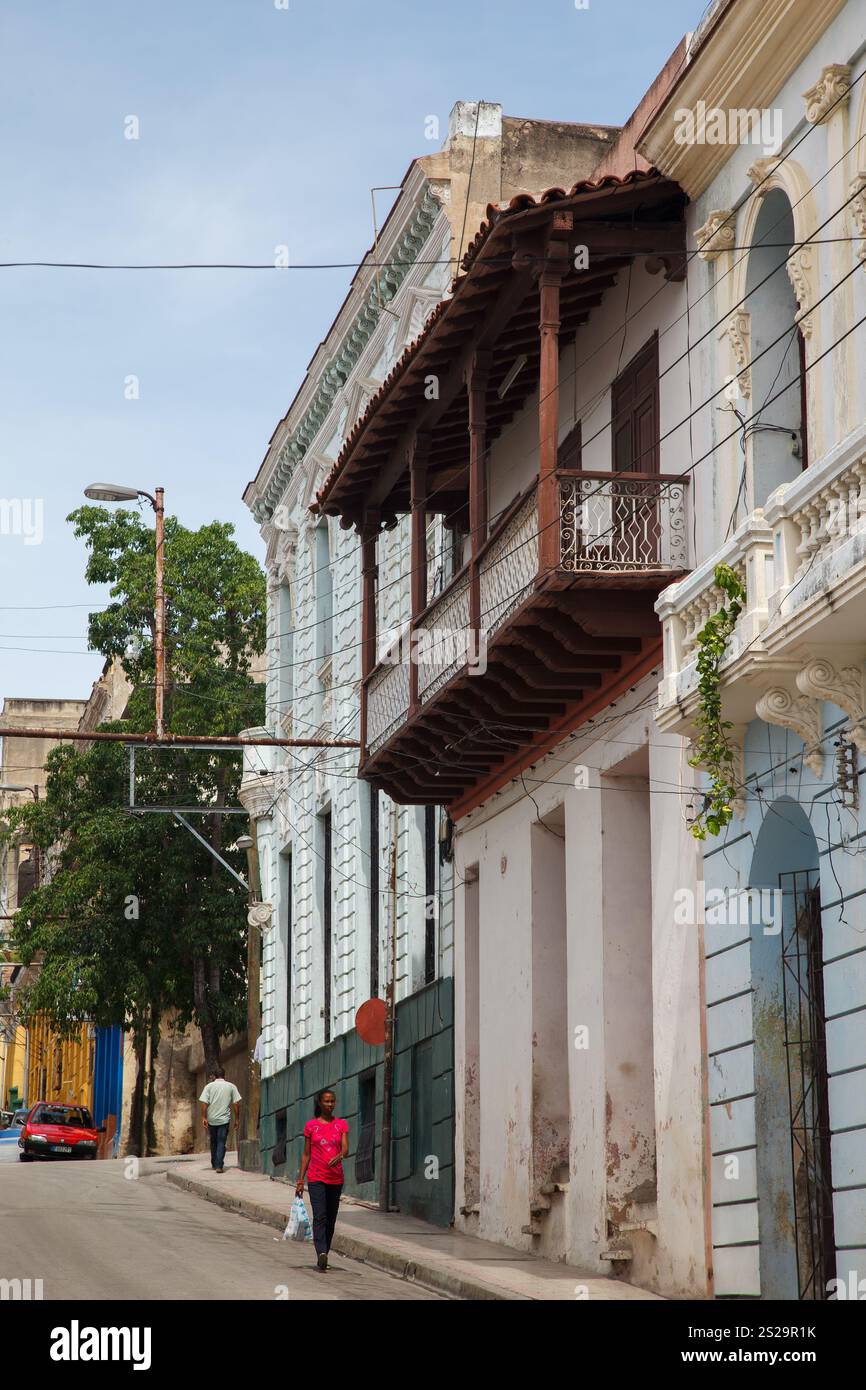 The typical tradiional colonial houses in a street of Santiago de Cuba ...