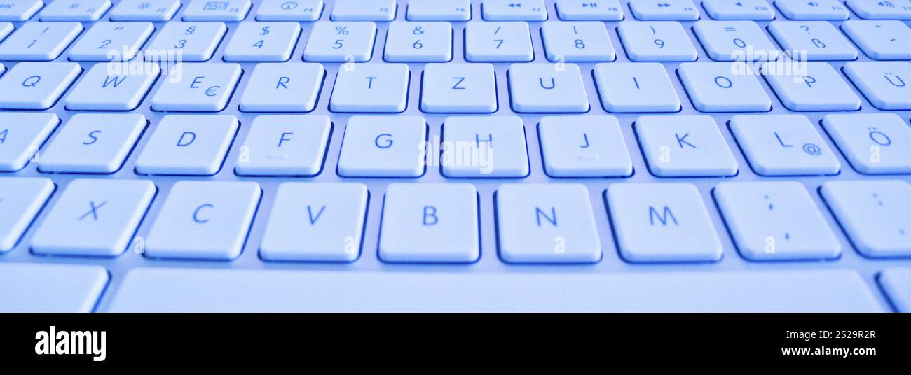 The keyboard of a computer in front of a screen. Data processing and ...