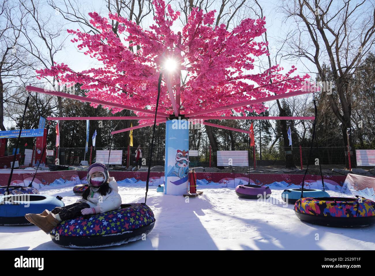 Children play the ice and snow games in Beijing Yuanmingyuan Park on ...