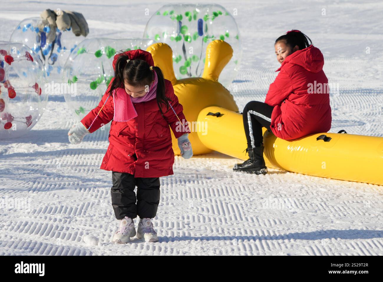 Children play the ice and snow games in Beijing Yuanmingyuan Park on ...