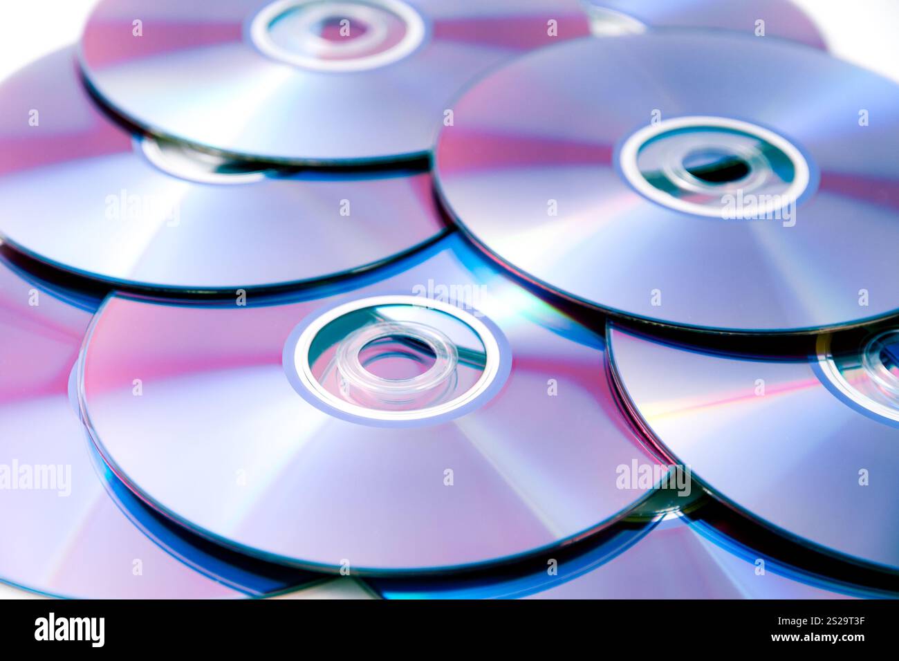 Colorful CD, DVD stack wallpaper background Stock Photo - Alamy
