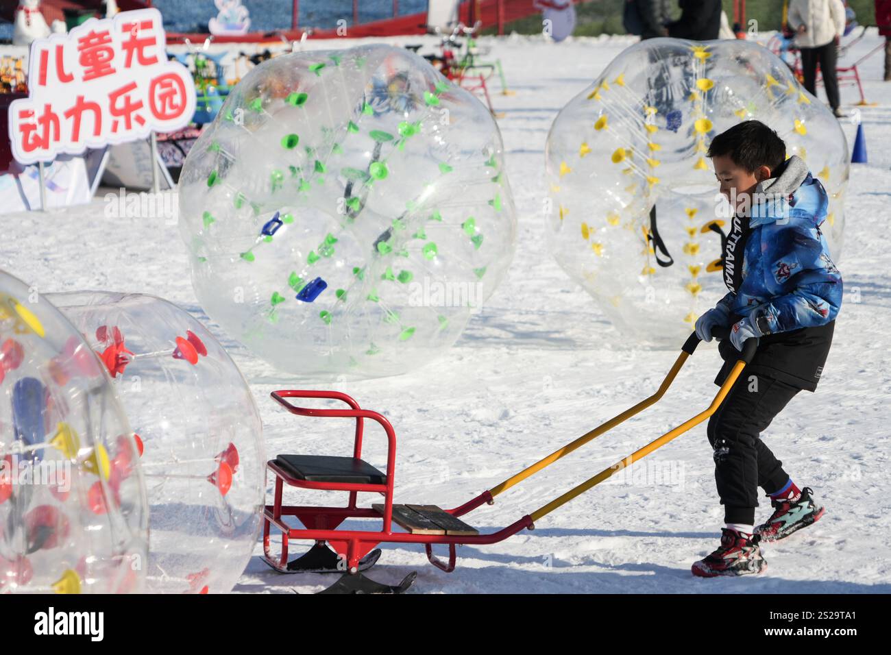 Children play the ice and snow games in Beijing Yuanmingyuan Park on ...