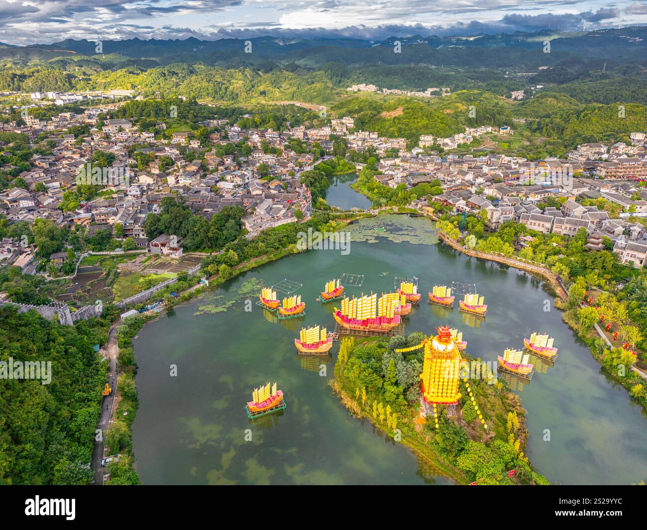 The pond with ships and streets of Qingyan Ancient Town, one of the top ...