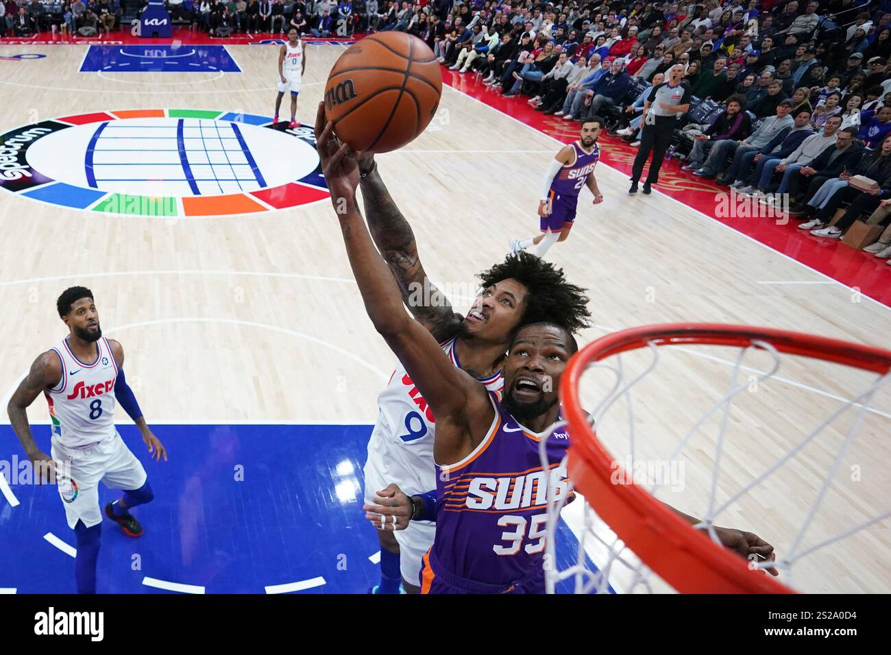 Phoenix Suns' Kevin Durant, right, and Philadelphia 76ers' Kelly Oubre ...
