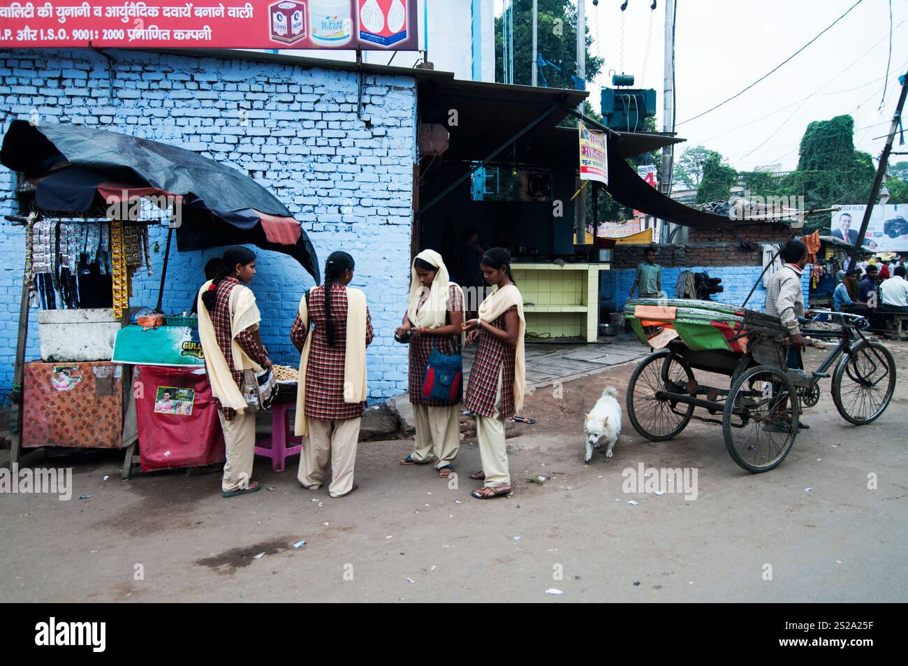 Female college students standing by a snack stall in Lucknow, India ...