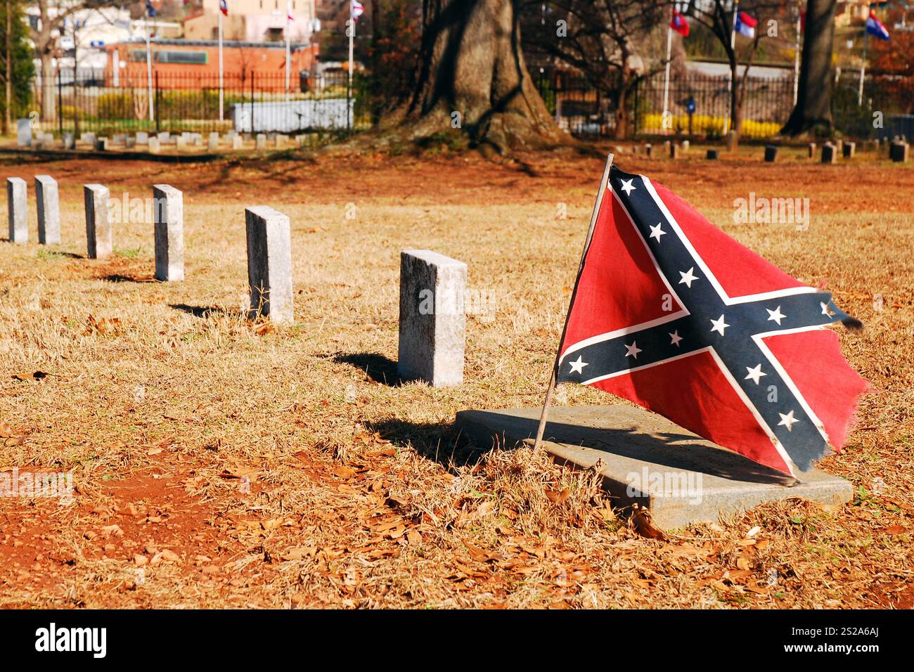 A small confederate flag stands of the grave of a Civil War soldier at ...