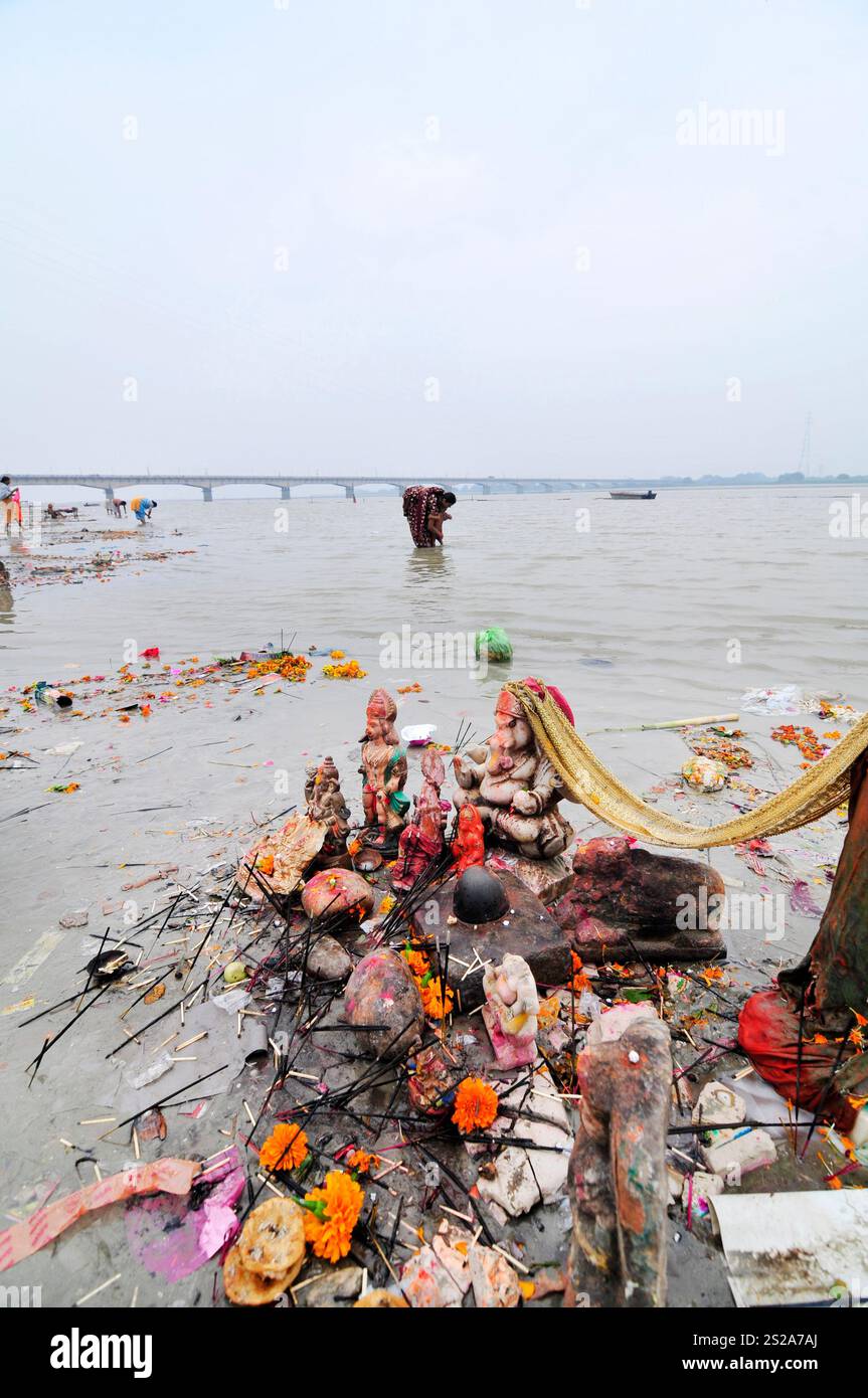 Tiny god statues in a small Hindu temple on the bank of the Ghaghara ...