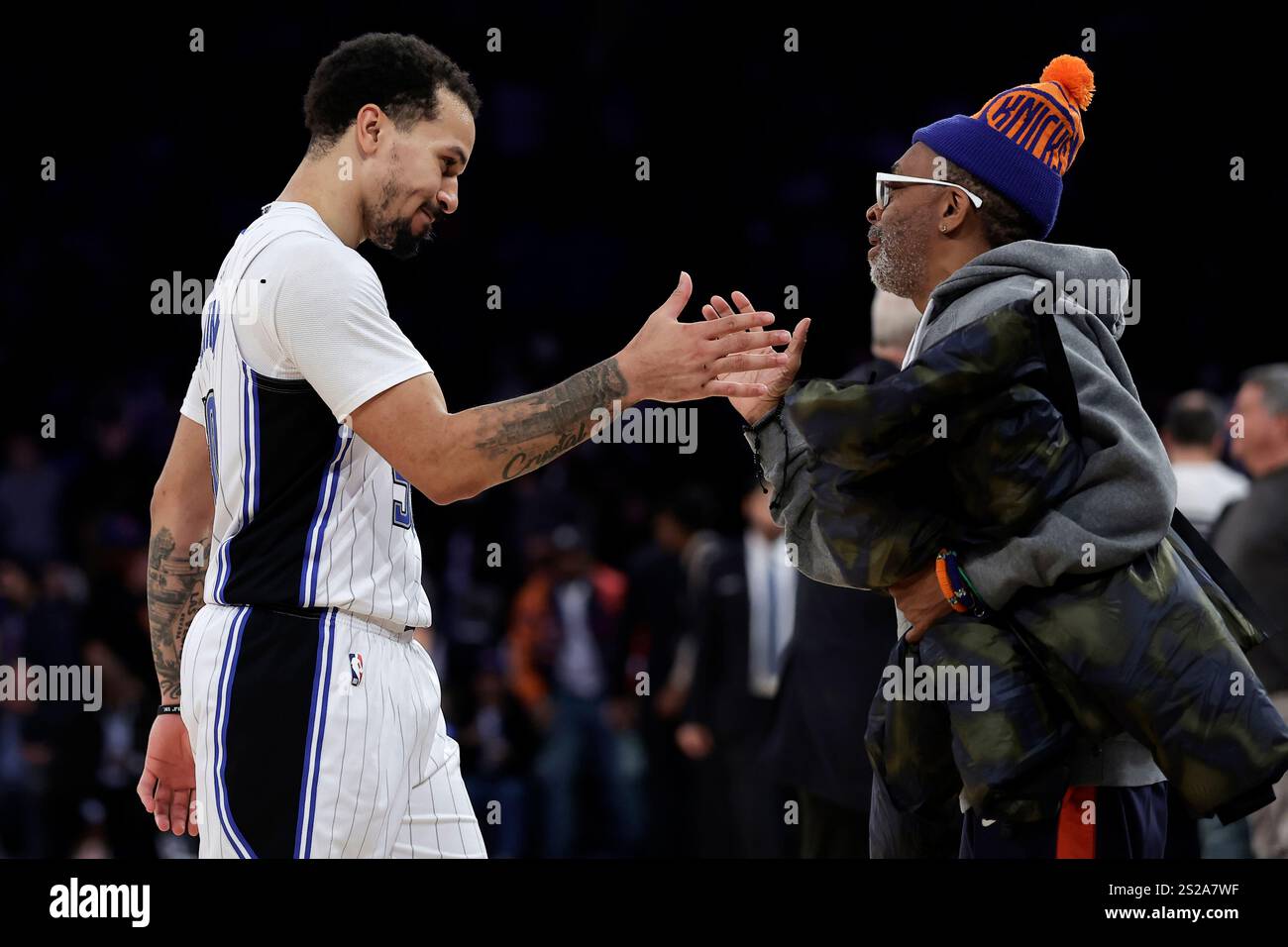 Orlando Magic guard Cole Anthony, left, shakes hands with film director ...
