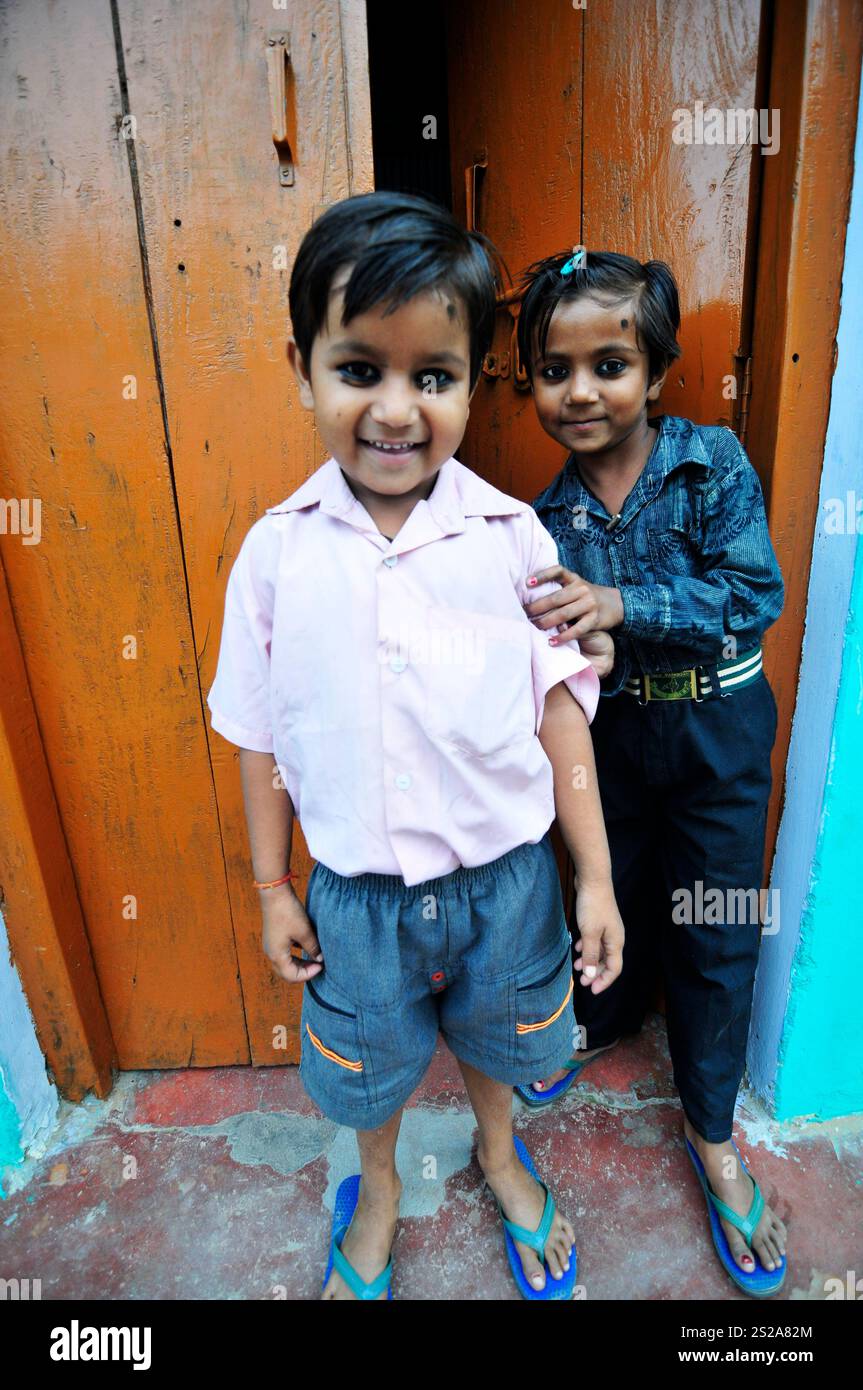 Cute Indian children standing outside their home in the old city of ...