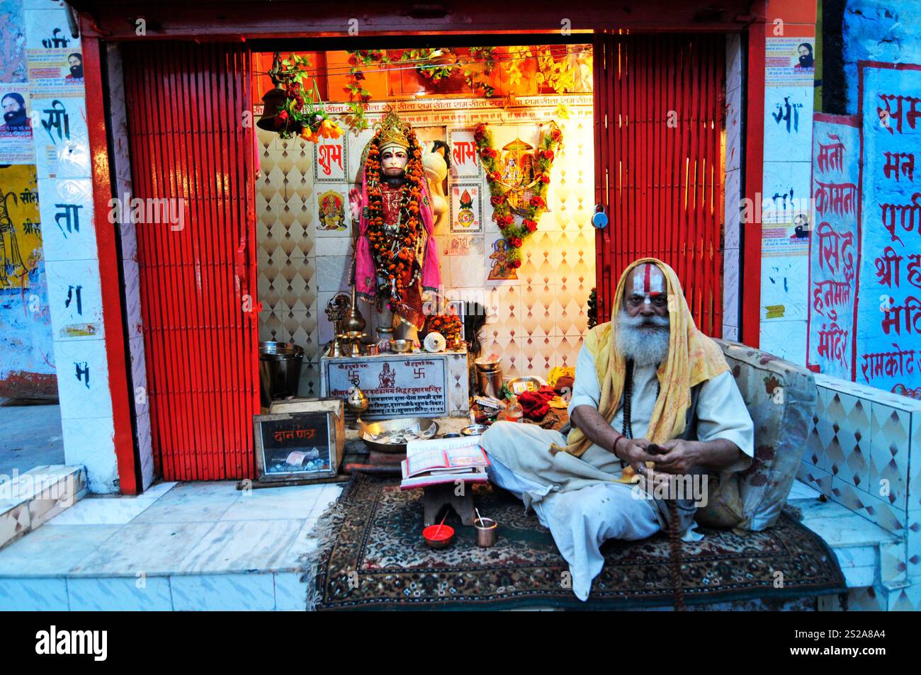 A Hindu priest at a small Hanuman ( Monkey God ) temple in Ayodhya ...