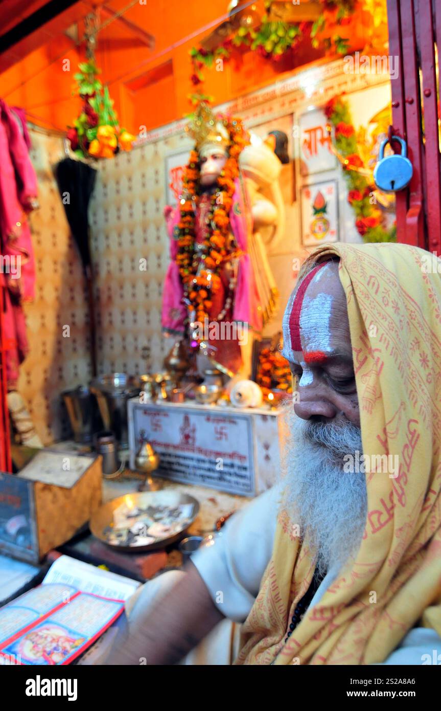 A Hindu priest at a small Hanuman ( Monkey God ) temple in Ayodhya ...