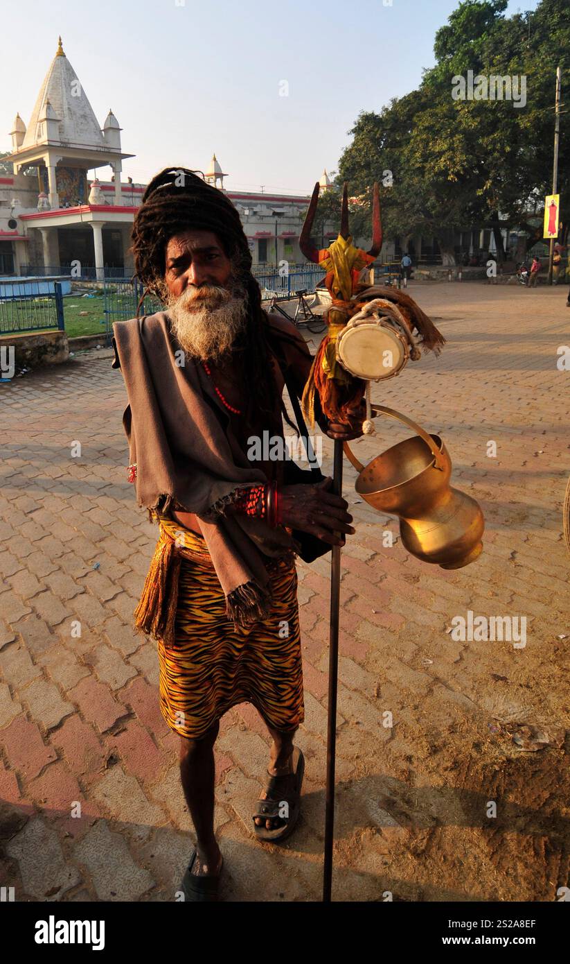 A Shaivite sadhu standing outside the railway station in Ayodhya, Uttar ...