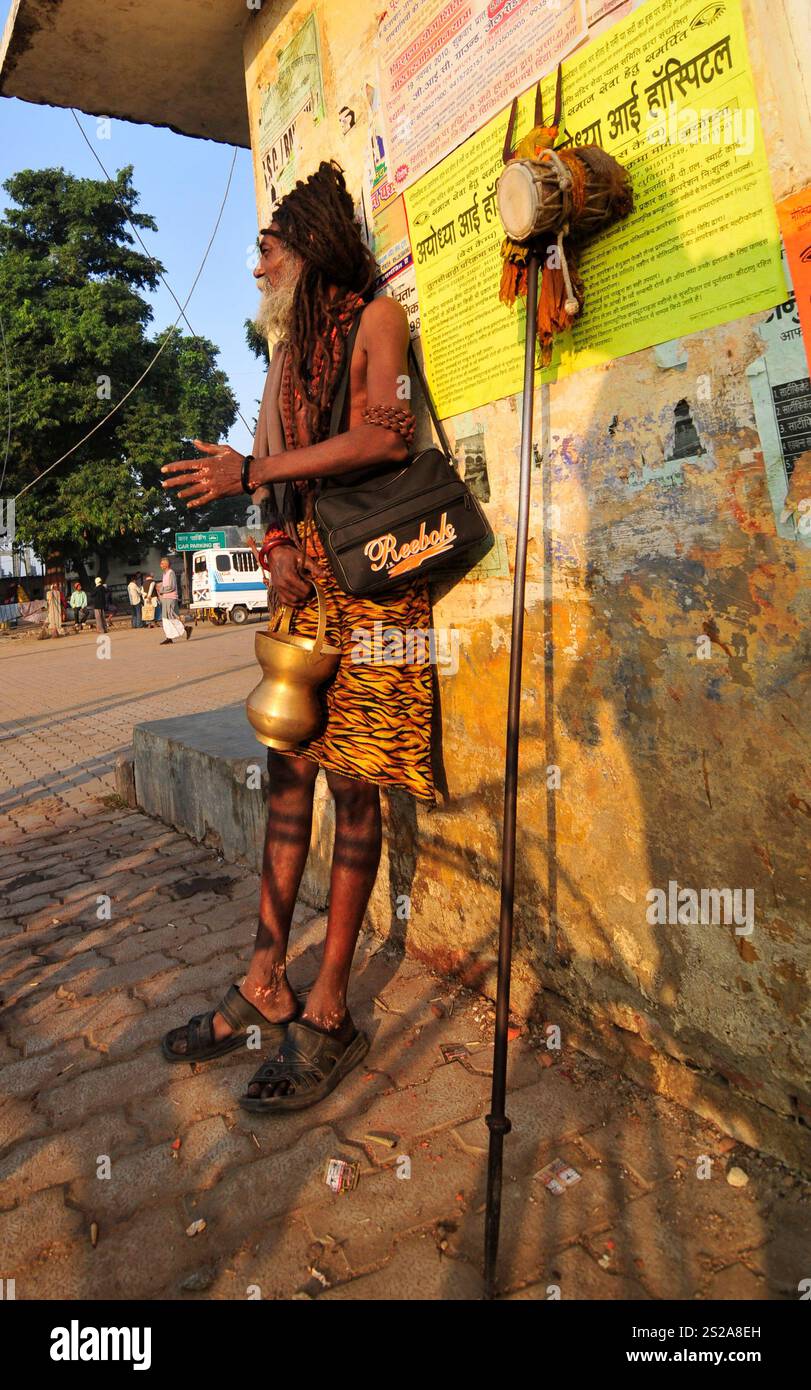 A Shaivite sadhu standing outside the railway station in Ayodhya, Uttar ...