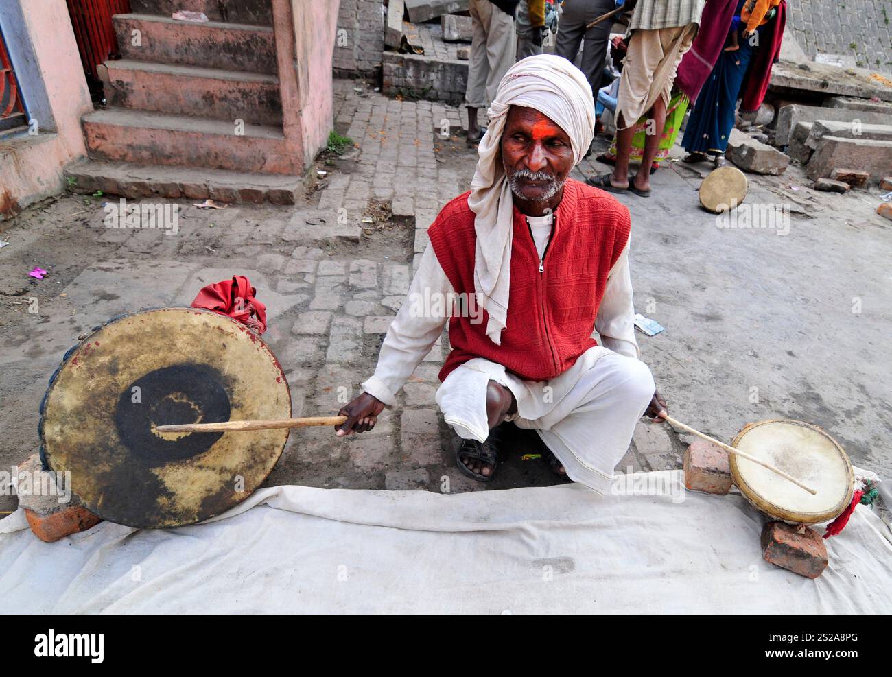 Percussion players playing by a Hindu temple in Ayodhya, Uttar Pradesh ...
