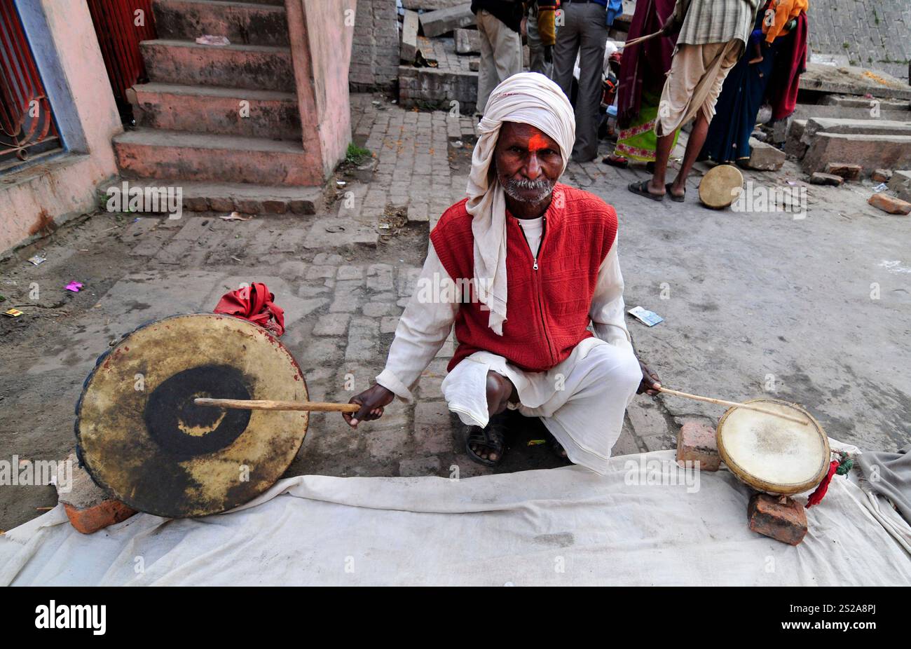 Percussion players playing by a Hindu temple in Ayodhya, Uttar Pradesh ...
