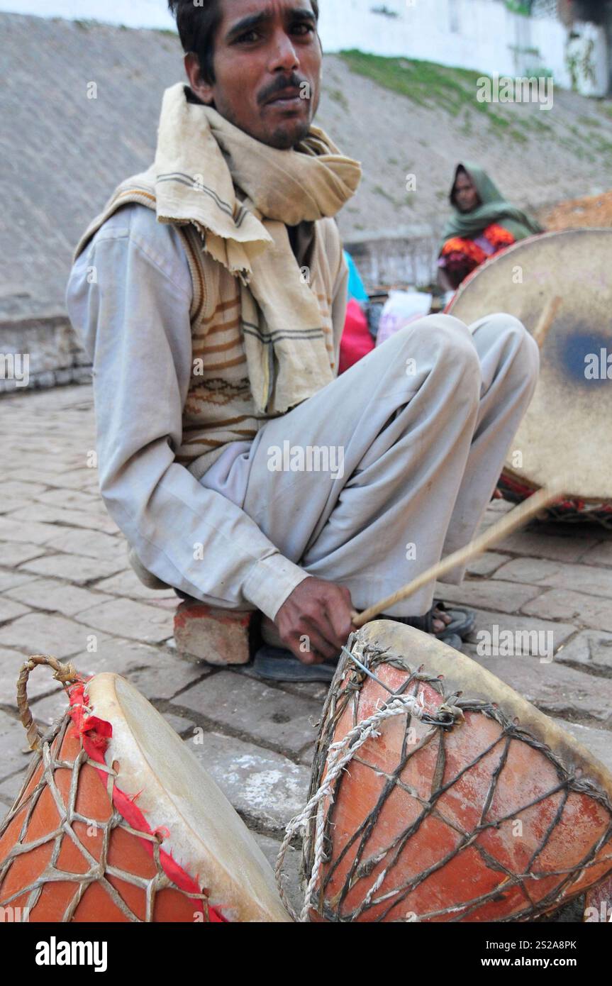Percussion players playing by a Hindu temple in Ayodhya, Uttar Pradesh ...